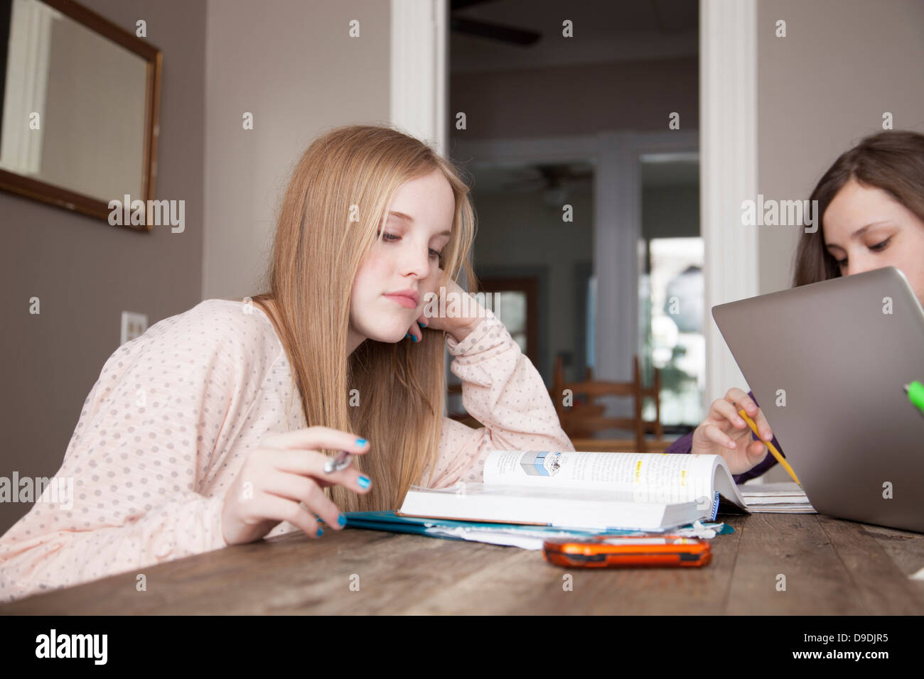 Young girl child head down writing hi-res stock photography and images ...
