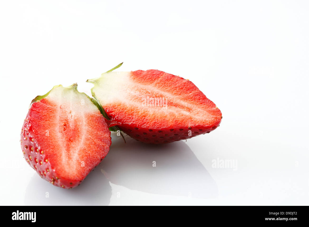 Two halves of fresh, Ripe Strawberry Stock Photo - Alamy
