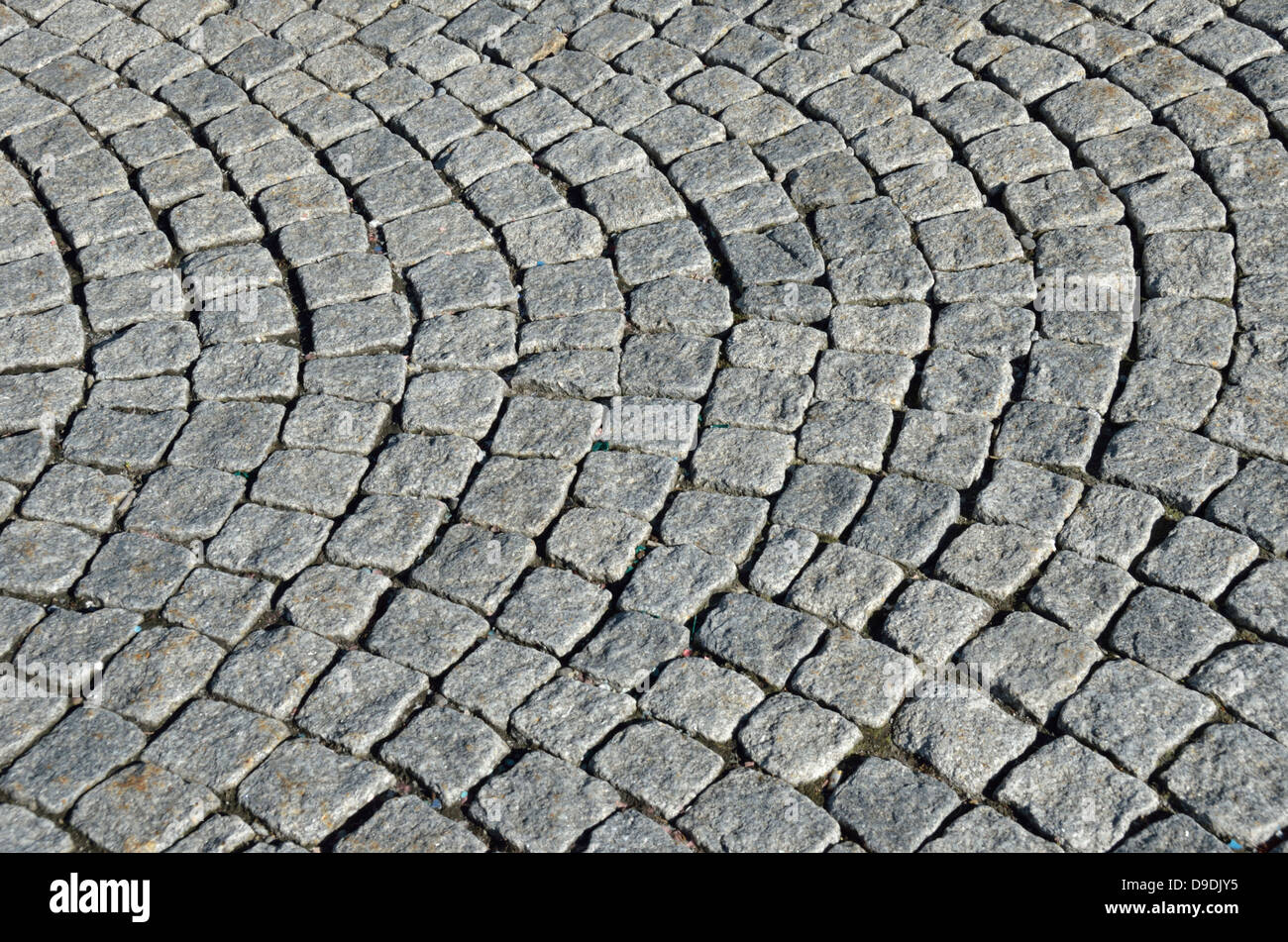 Curved pattern of cobbles on a pavement Stock Photo - Alamy