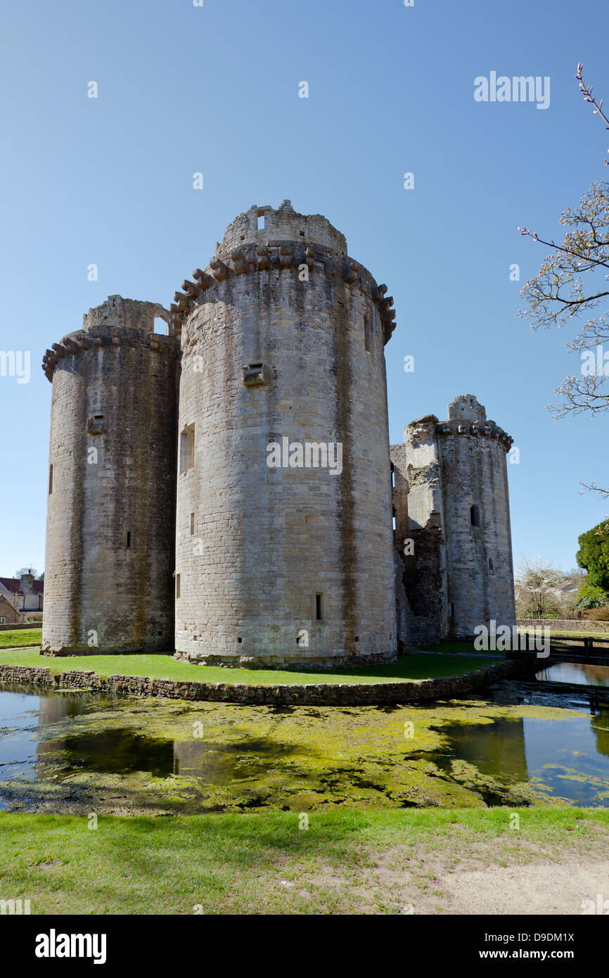 The ruins of Nunney Castle surrounded by its moat, built in the 1370s ...