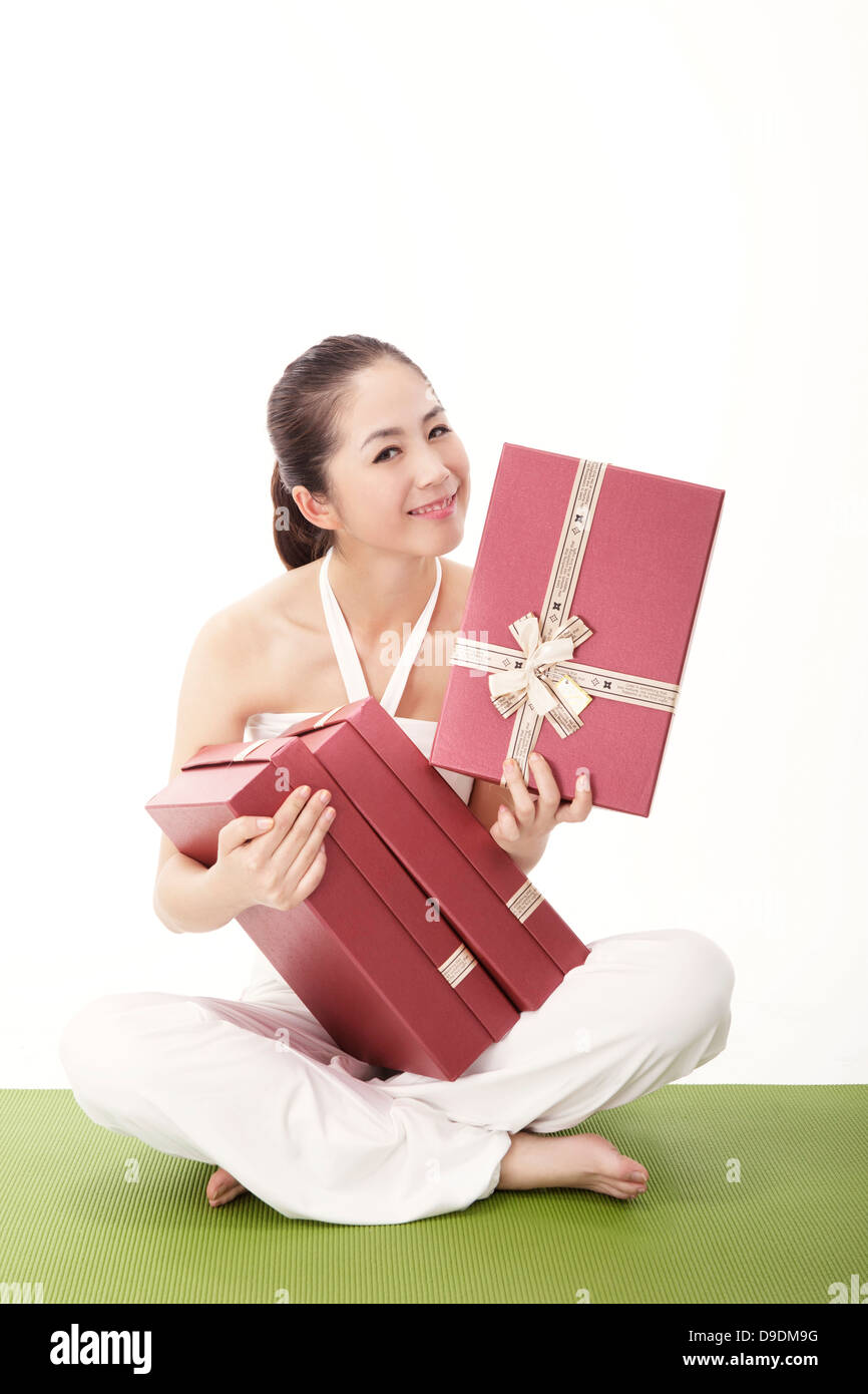 Business woman with gift box Stock Photo - Alamy