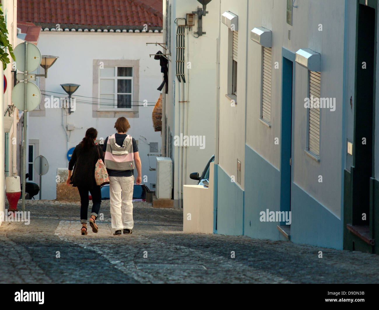 A couple stroll down a hill in Lagos Stock Photo - Alamy