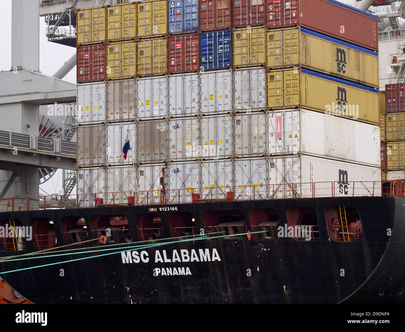 containers stacked high on the rear deck of the Panama registered msc ...