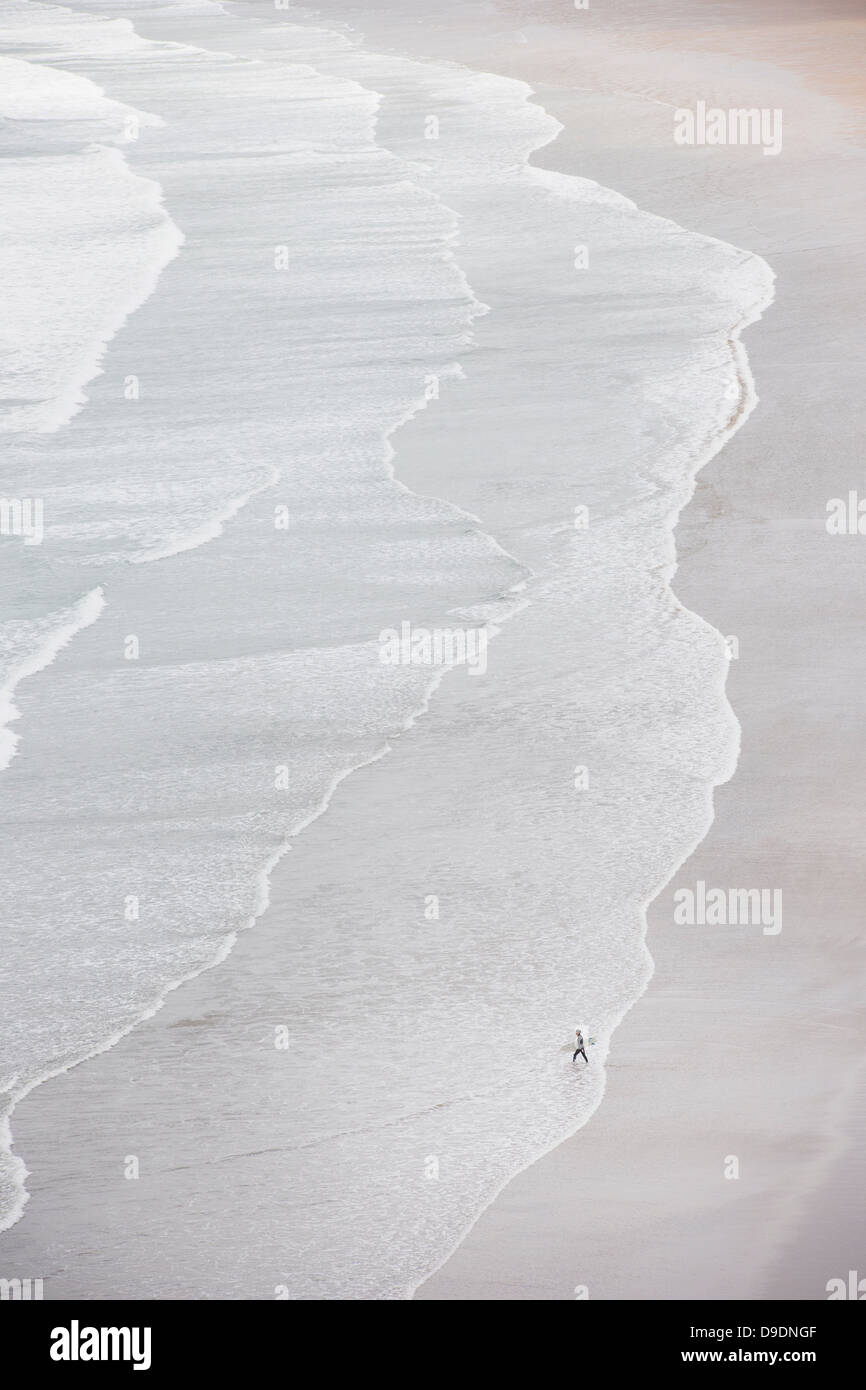 Person alone on beach, high angle Stock Photo - Alamy