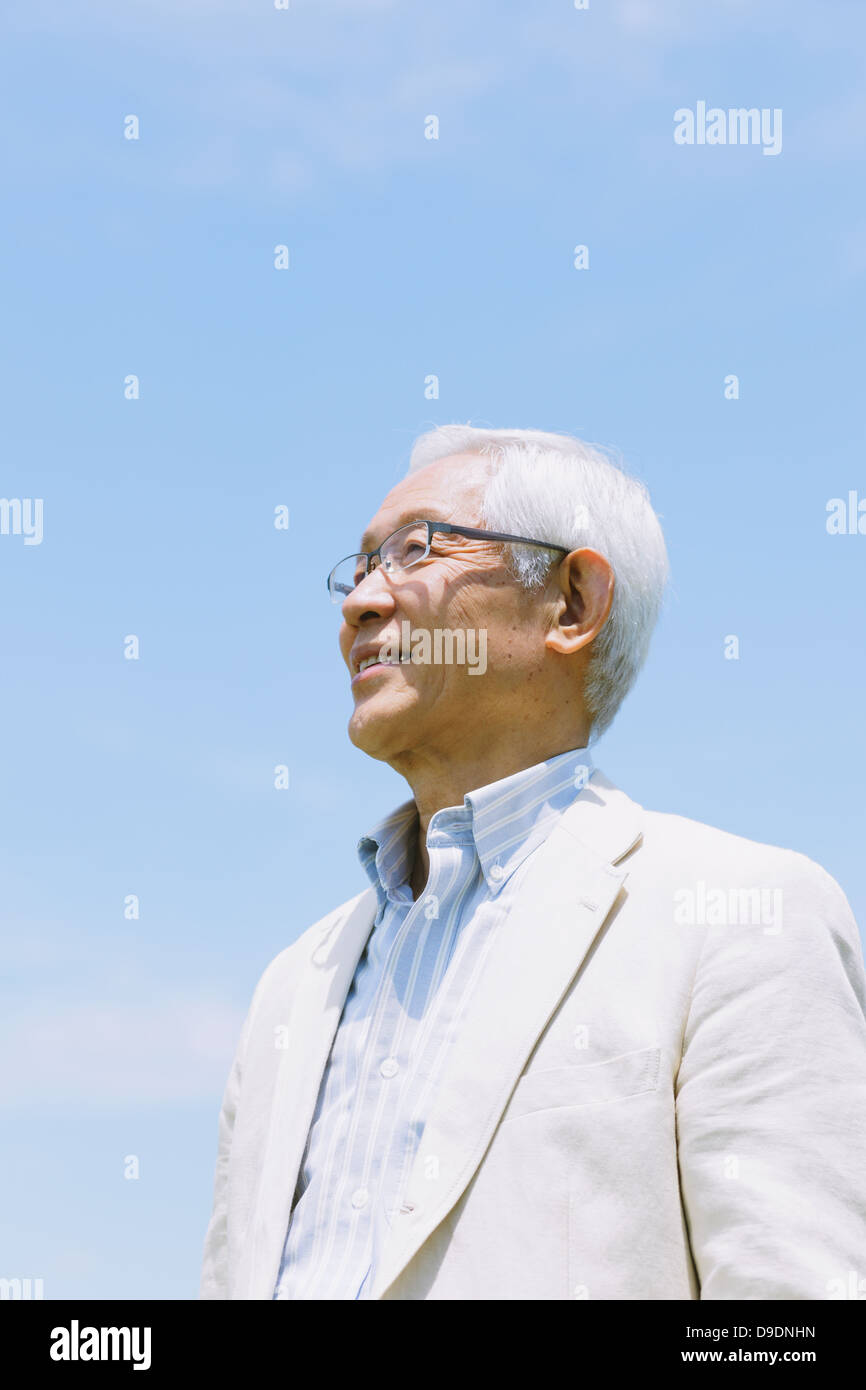 Senior man smiling away Stock Photo - Alamy