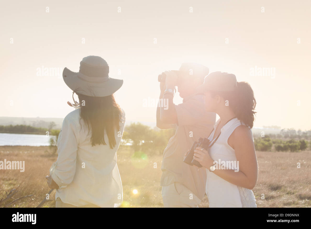 People using binoculars on a safari, Stellenbosch, South Africa Stock ...