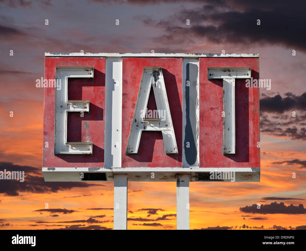 Vintage eat sign ruin with sunset sky Stock Photo - Alamy