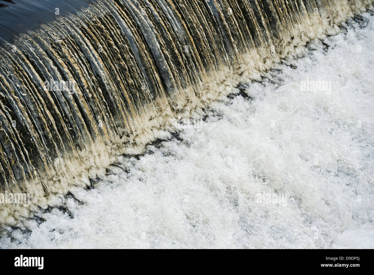 a dam overflowing river stream water weir wier UK Stock Photo - Alamy
