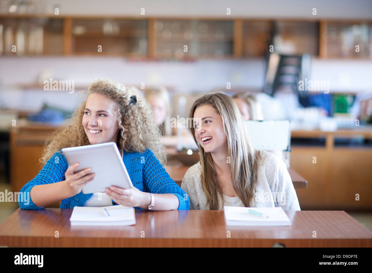 Classmates enjoying lesson Stock Photo - Alamy
