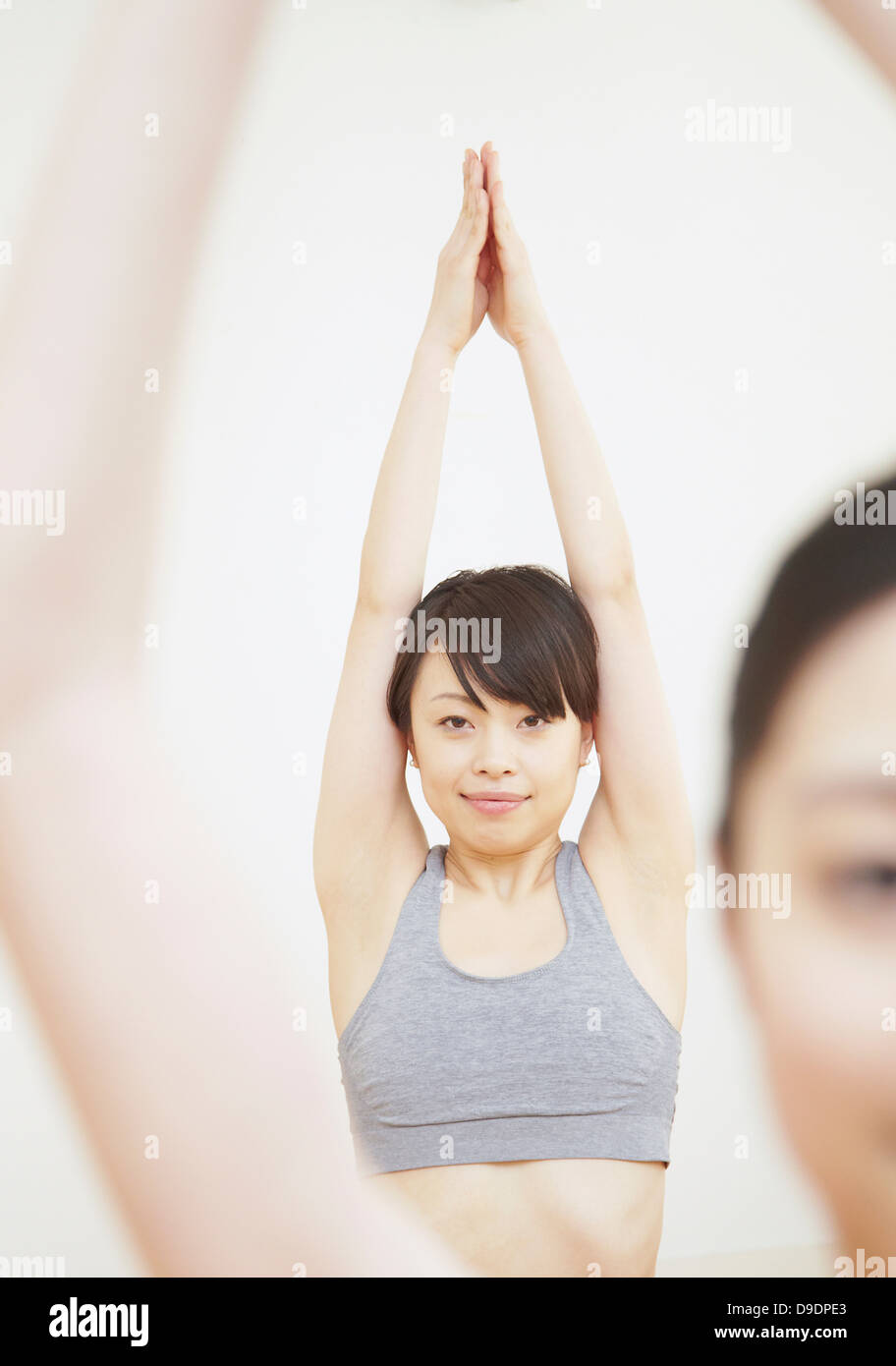 Woman raised two hands hi-res stock photography and images - Alamy