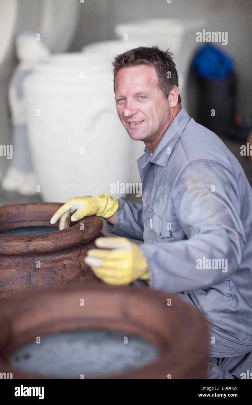 Painting and staining process in pottery factory Stock Photo - Alamy