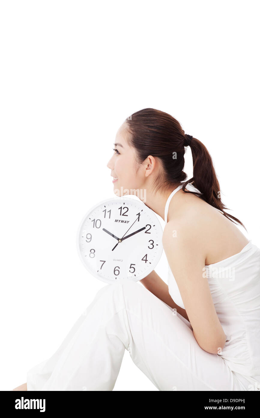 Young indian woman holding clock hi-res stock photography and images ...