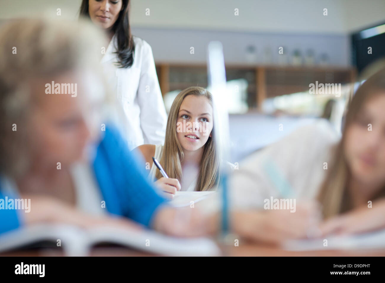 Science teacher in class Stock Photo - Alamy