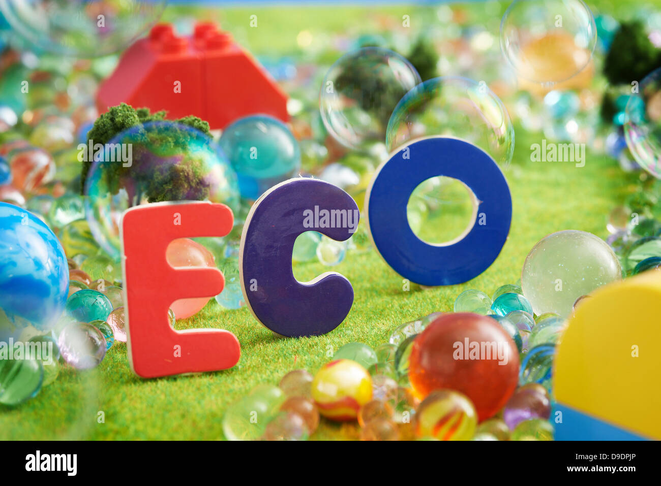 The word Eco on pretend grass with marbles Stock Photo - Alamy