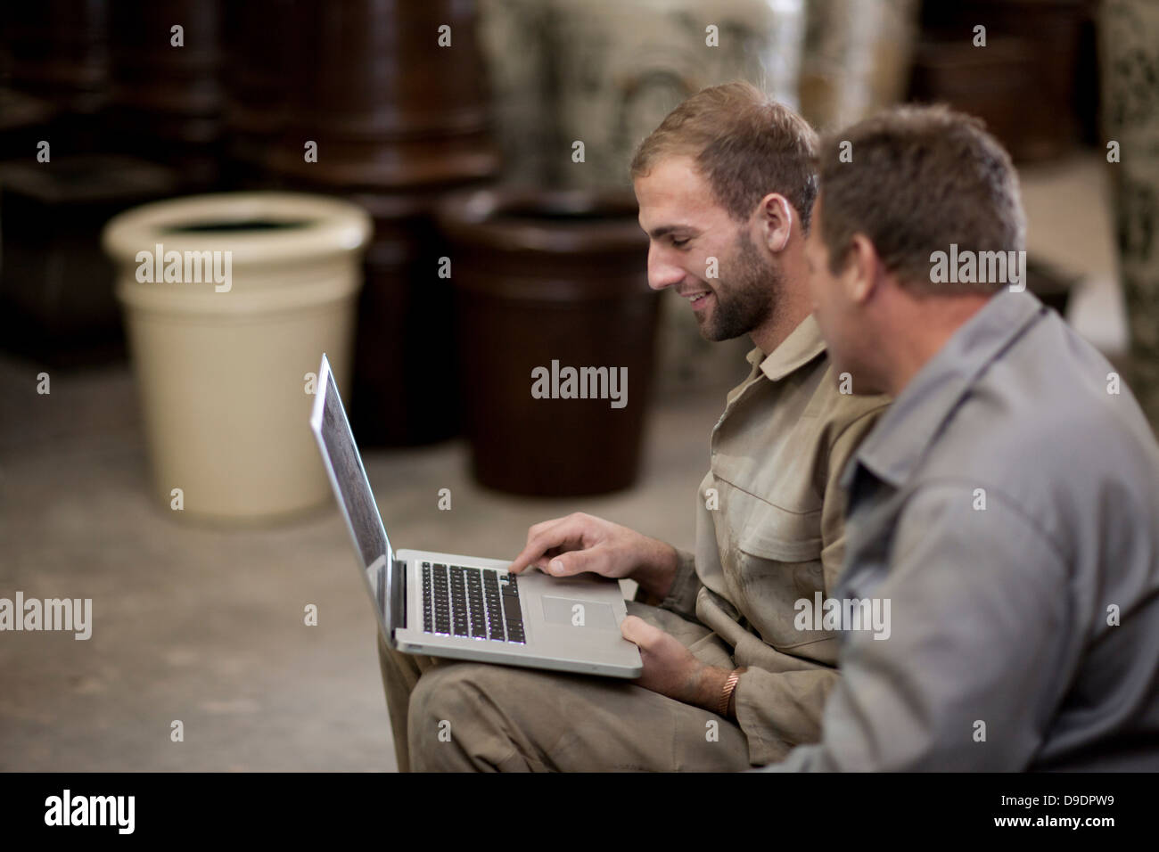 Factory worker taking a break Stock Photo - Alamy