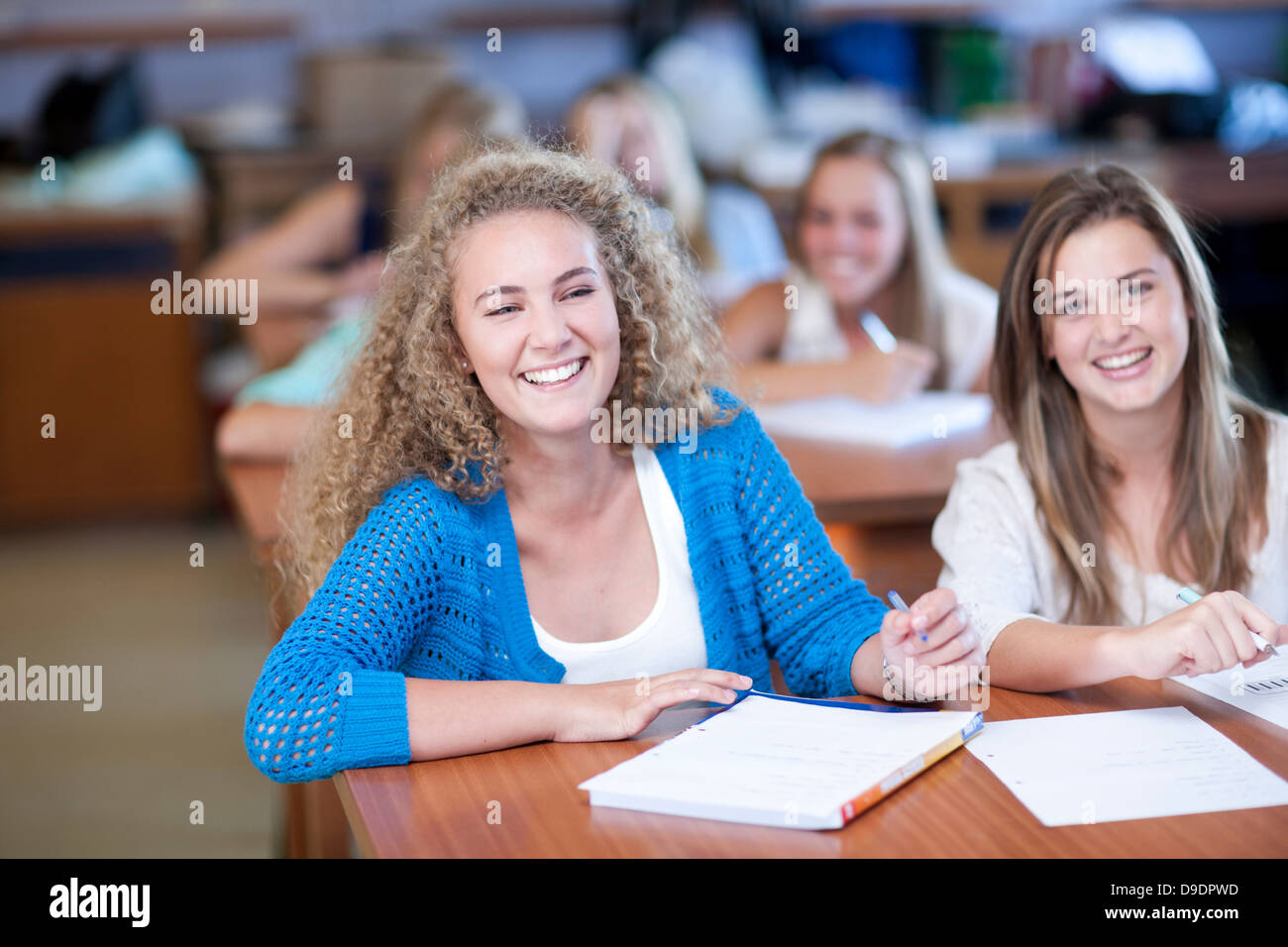 Classmates enjoying lesson Stock Photo - Alamy