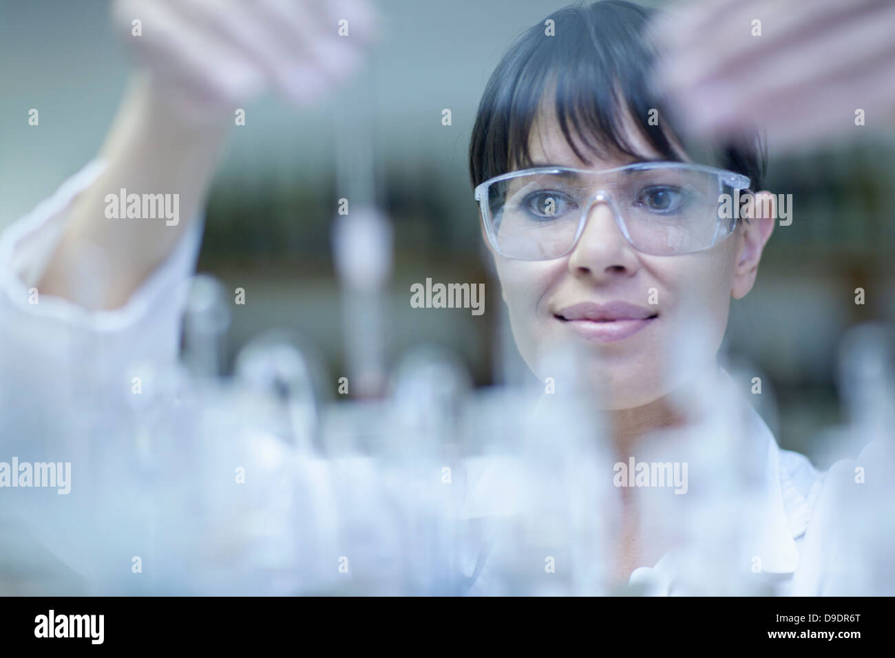 Oenologist mixing during sample testing in laboratory Stock Photo - Alamy