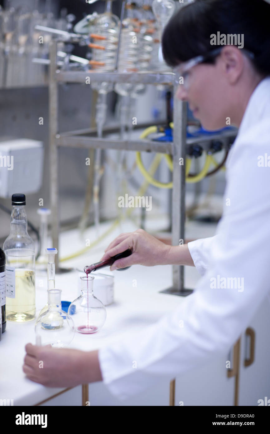 Oenologist mixing during sample testing in laboratory Stock Photo - Alamy