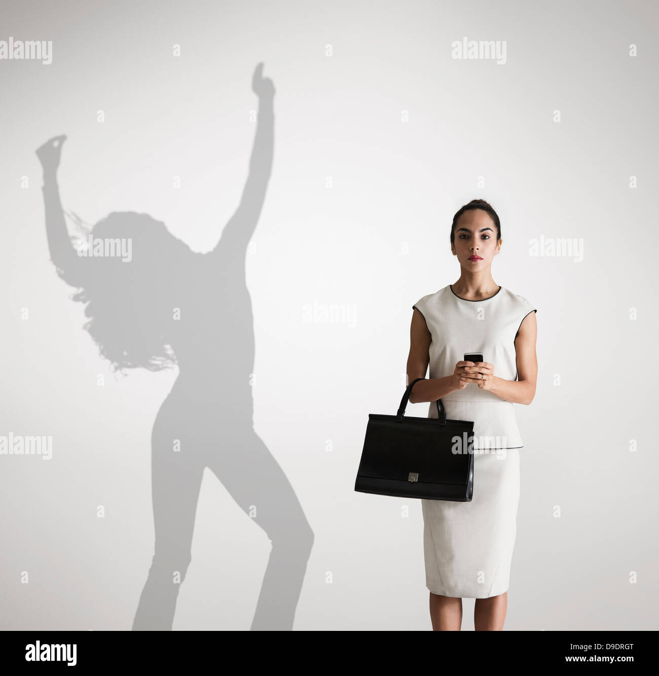 Woman with shadow in background dancing Stock Photo - Alamy