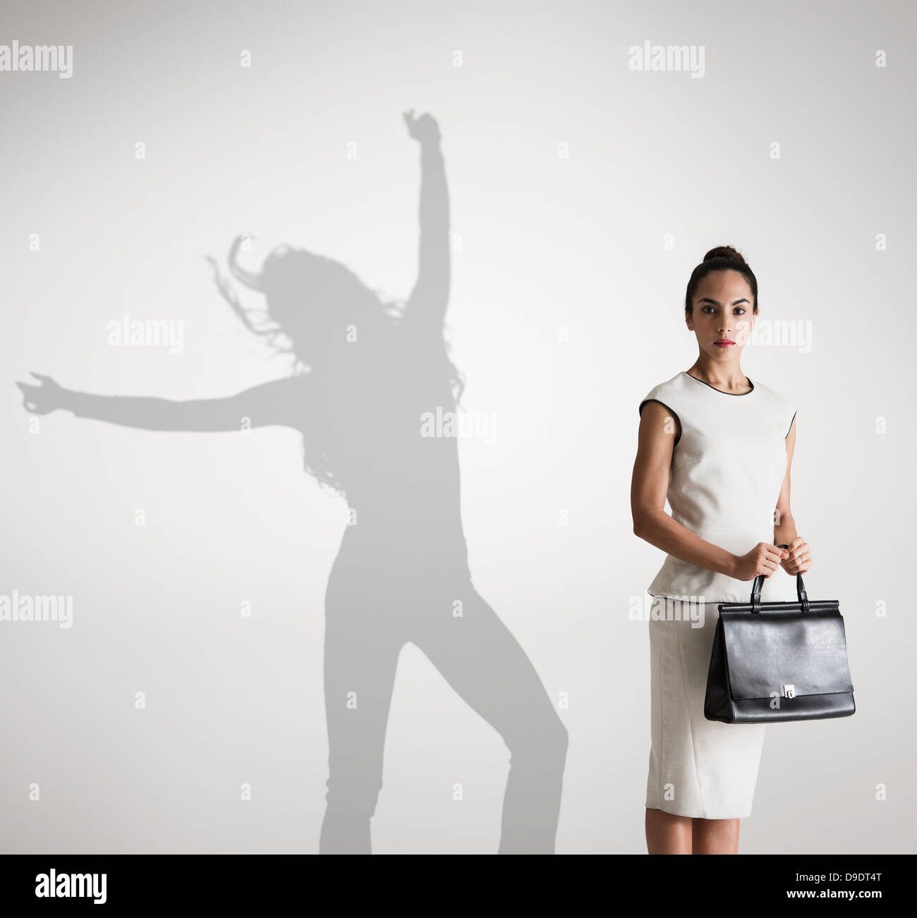 Woman with shadow in background dancing Stock Photo - Alamy