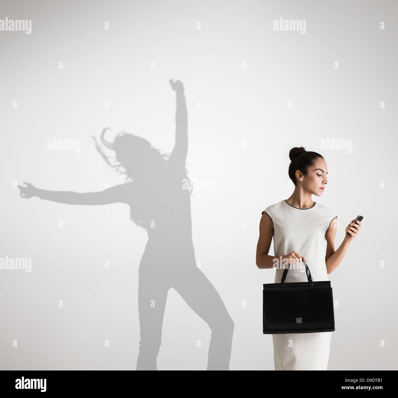 Woman with shadow in background dancing Stock Photo - Alamy