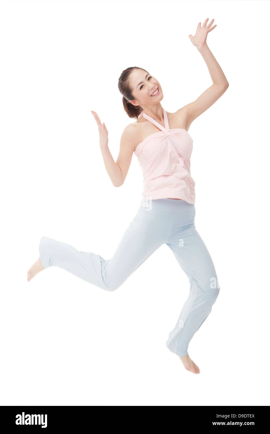 young woman dancing and jumping Stock Photo - Alamy