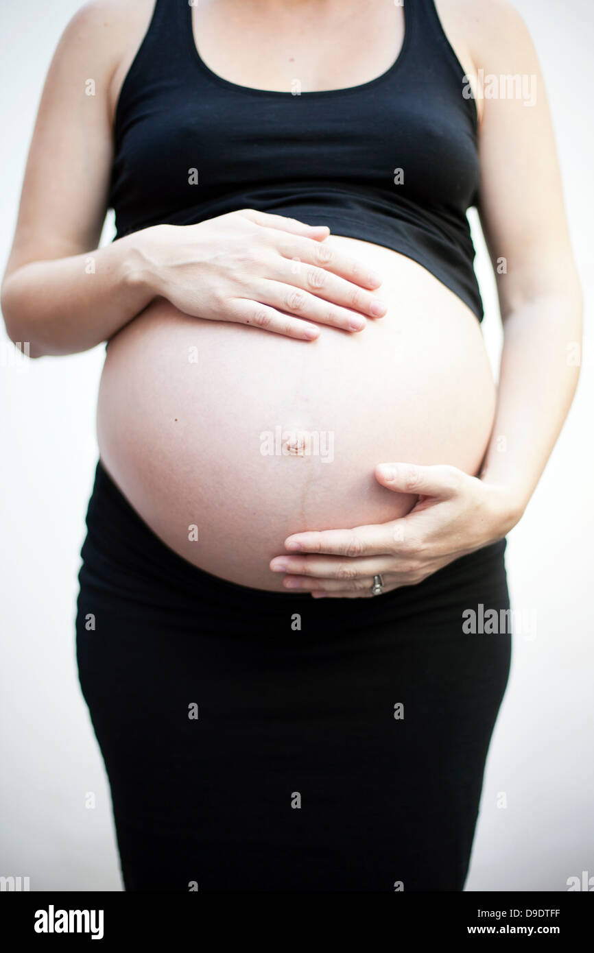 Belly of pregnant woman Stock Photo - Alamy