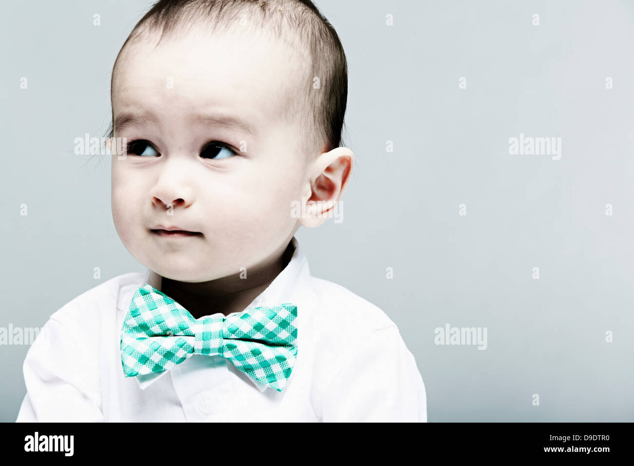 Boy wearing bow tie looking hi-res stock photography and images - Alamy