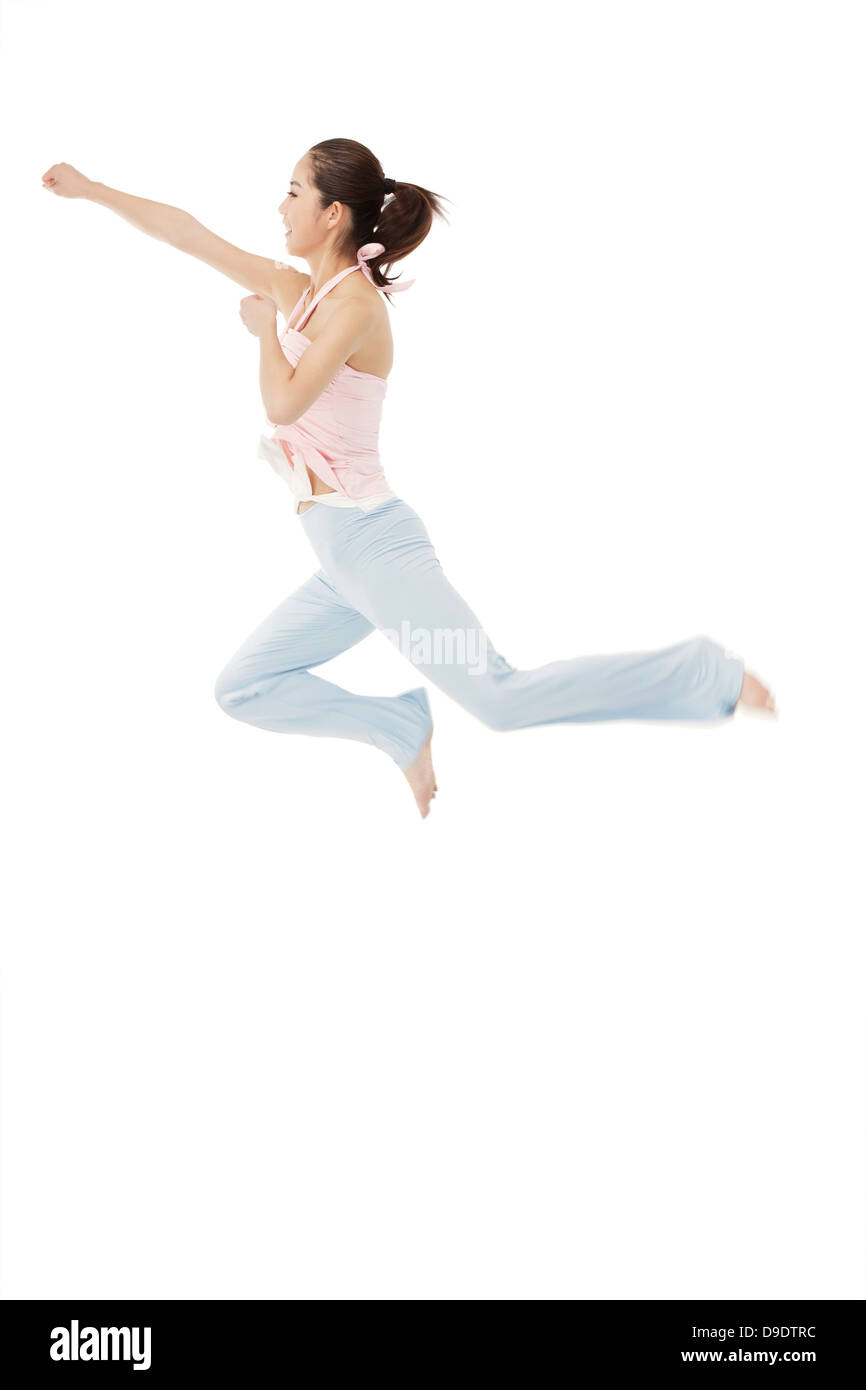 young woman dancing and jumping Stock Photo - Alamy