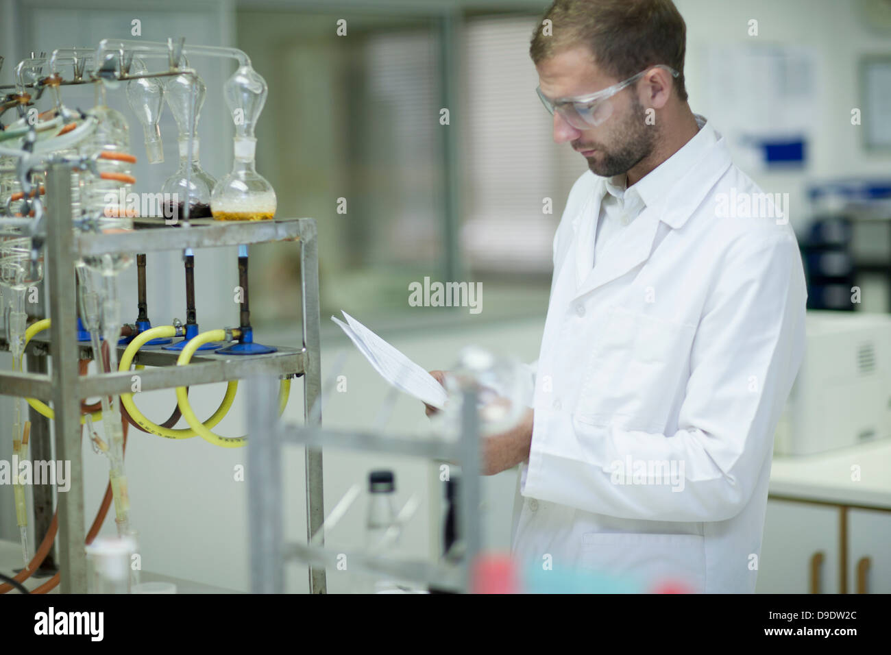 Oenologist monitoring sample testing in laboratory Stock Photo - Alamy