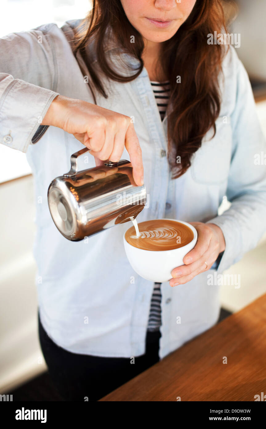 Barista making latte Stock Photo - Alamy