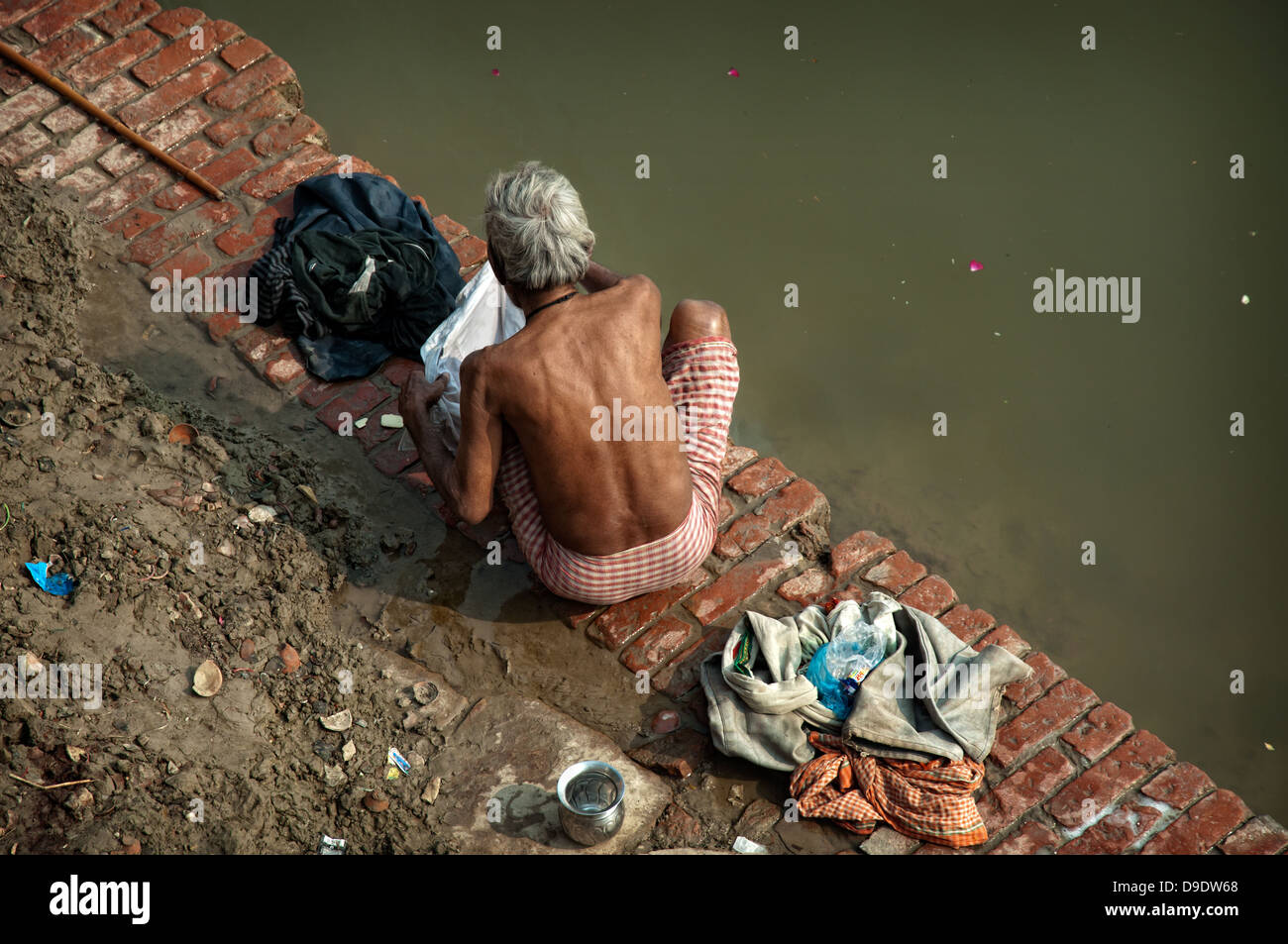 Indian man washing clothes hi-res stock photography and images - Alamy