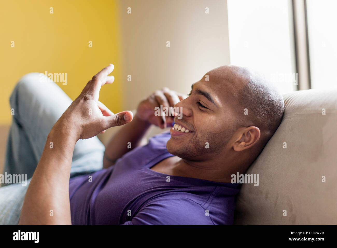 Man Lounging On Sofa High Resolution Stock Photography and Images - Alamy