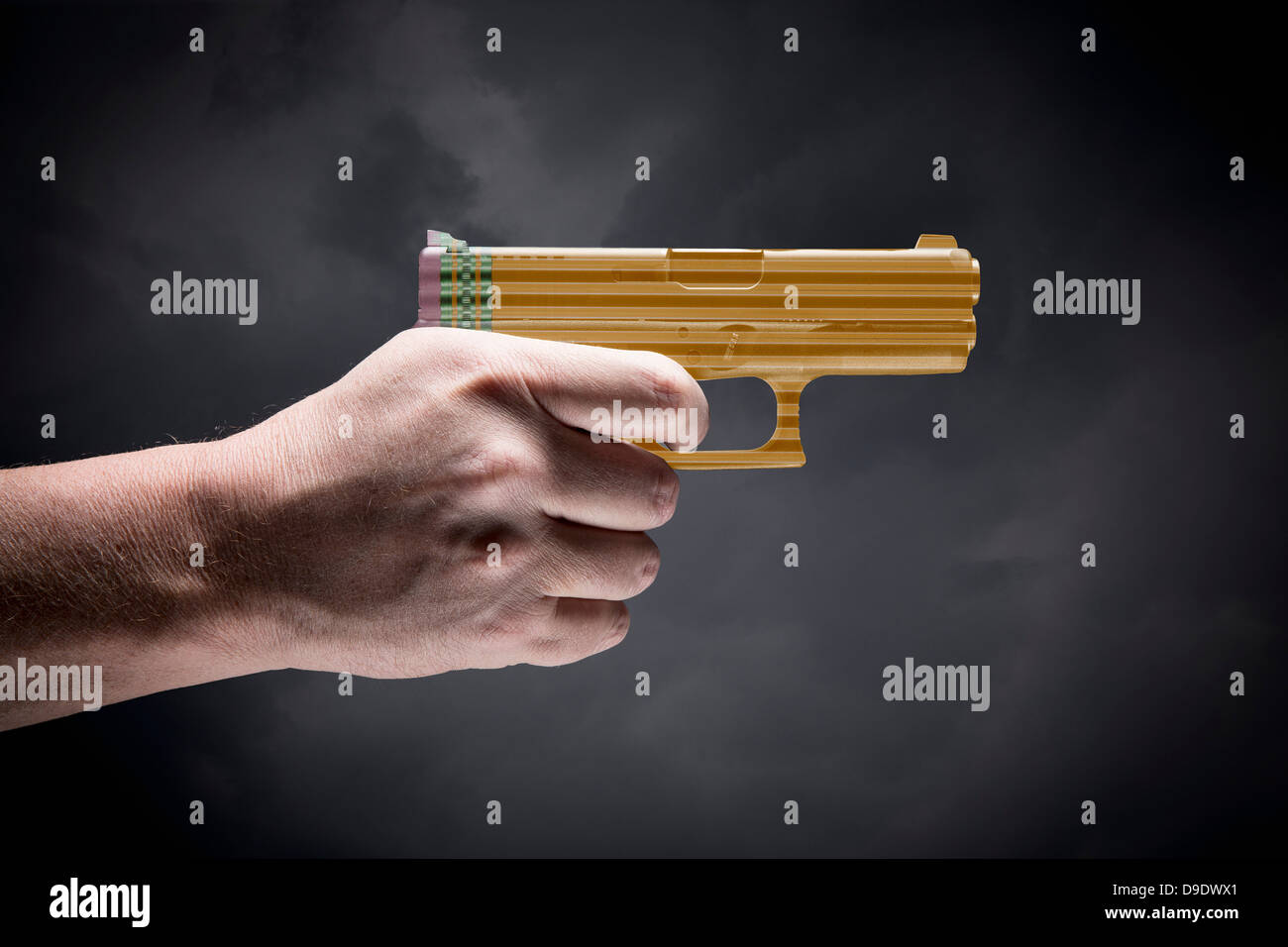 Person holding handgun made with pencils Stock Photo - Alamy