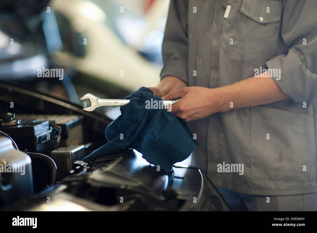 Car mechanic on completion of job Stock Photo - Alamy