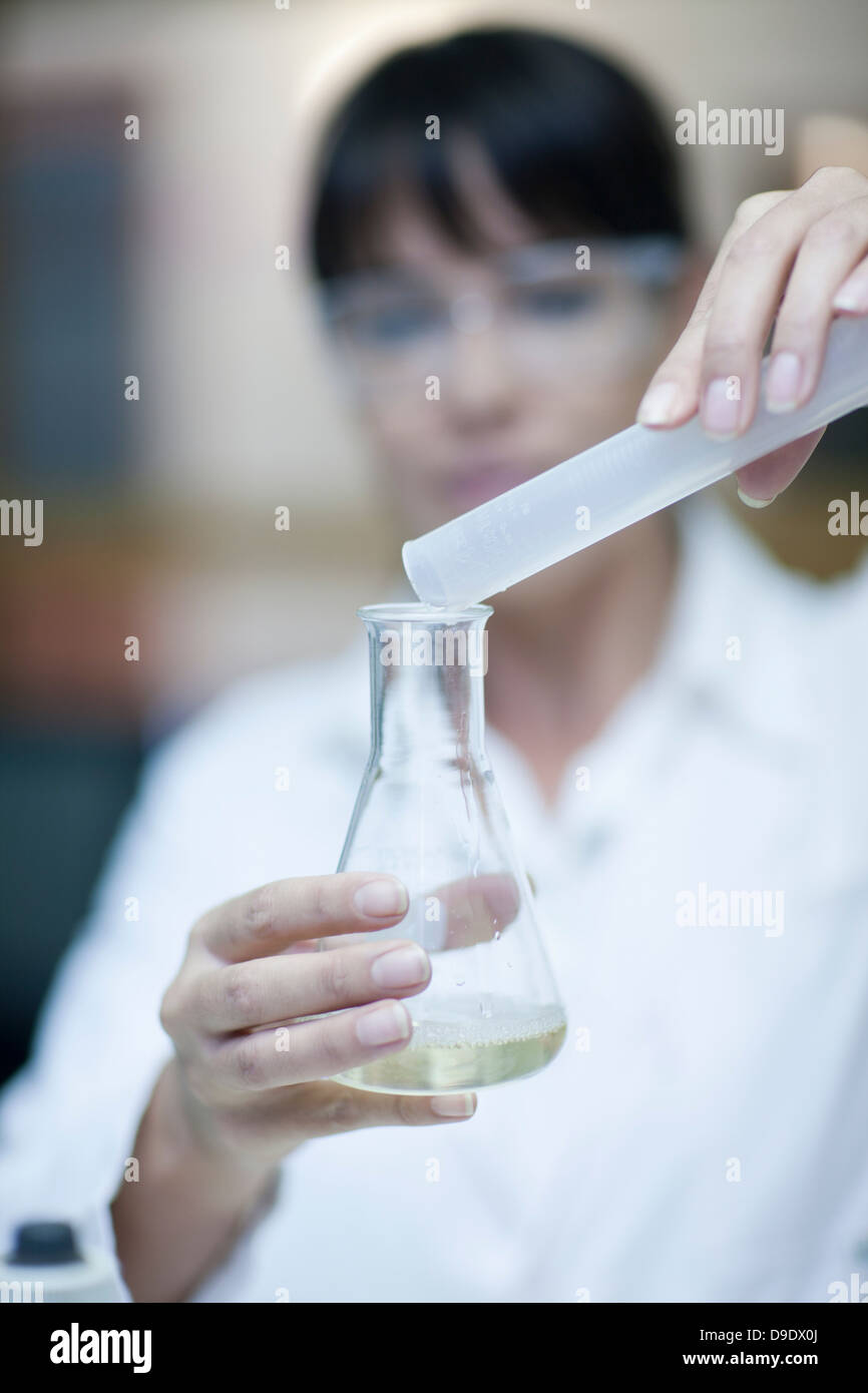 Oenologist mixing during sample testing in laboratory Stock Photo - Alamy