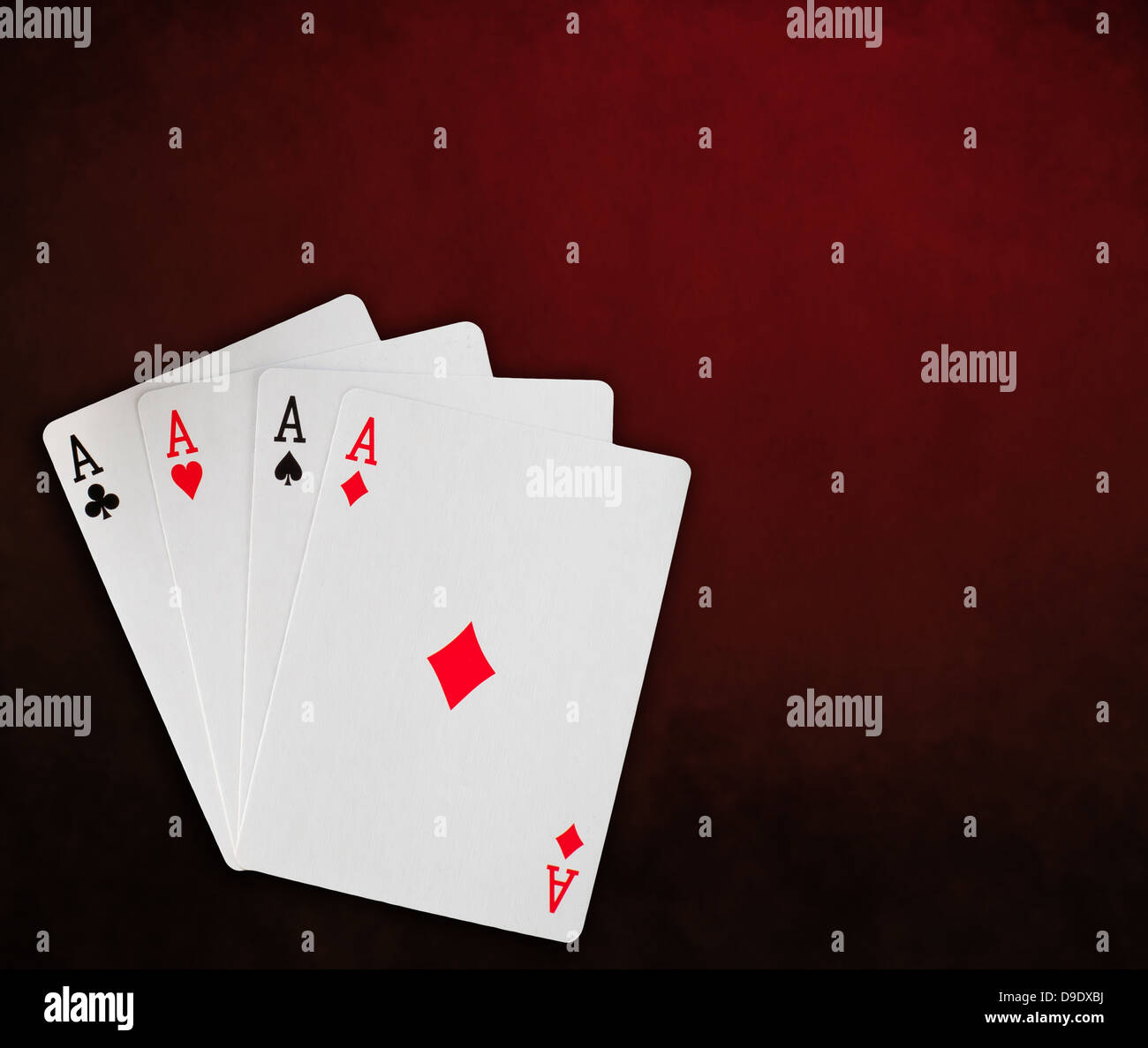 Poker cards on red background Stock Photo - Alamy