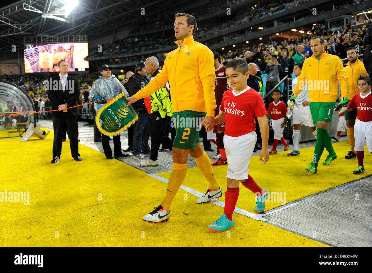 Sydney, Australia. 18th June 2013. Socceroos captain Lucas Neil leads ...