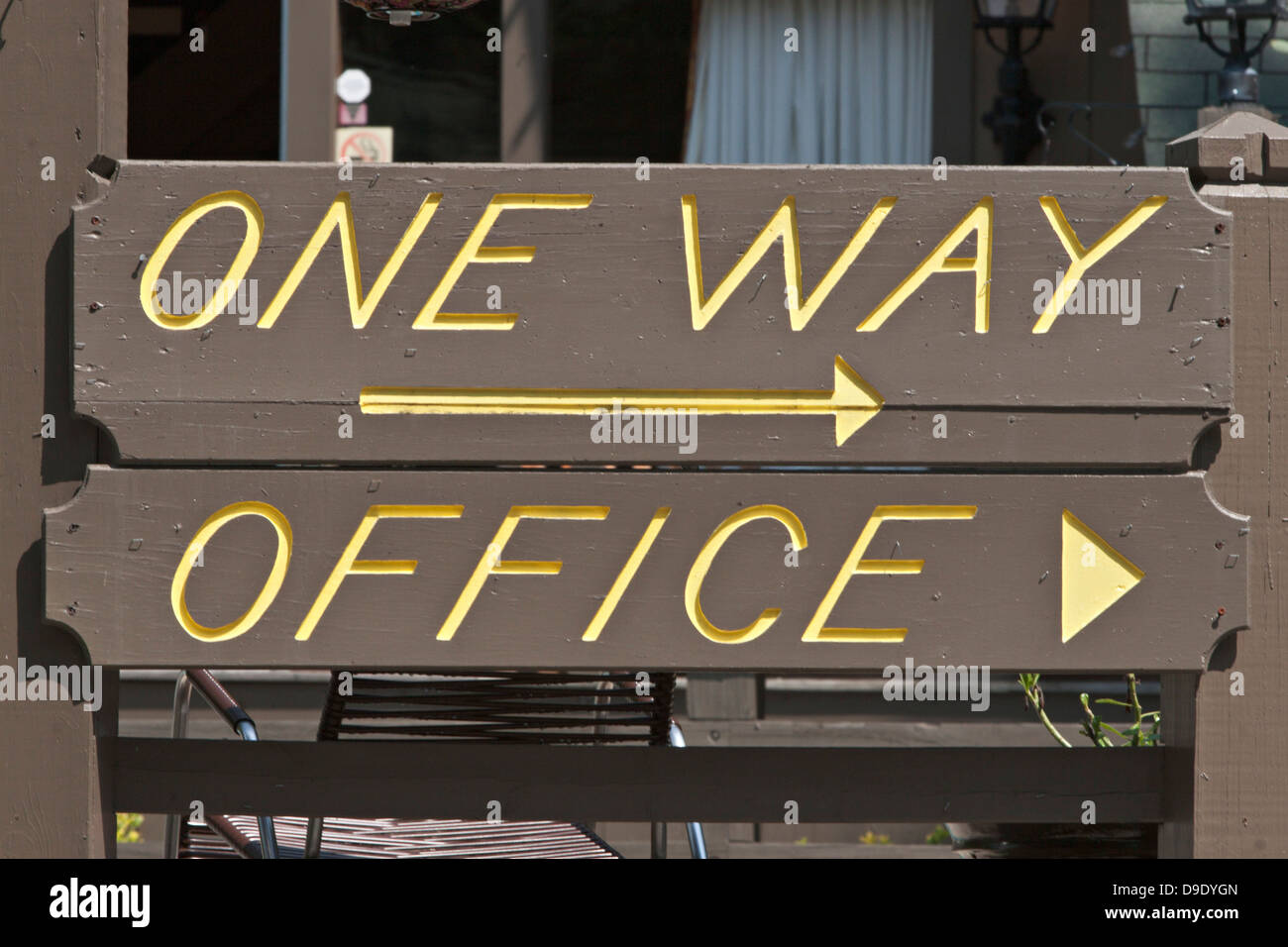 Motel office one way wooden sign Stock Photo - Alamy