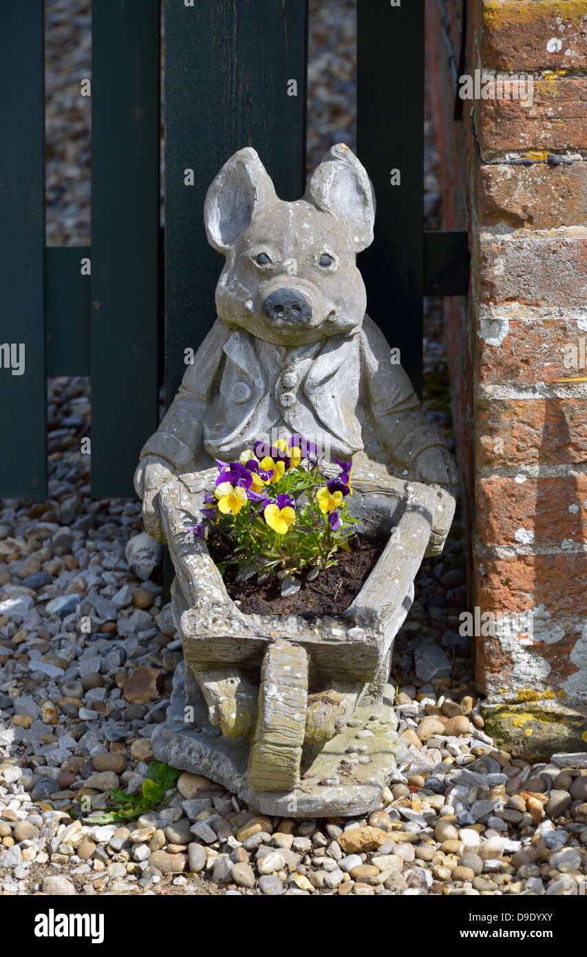 Ceramic pig and wheelbarrow flower container Stock Photo - Alamy