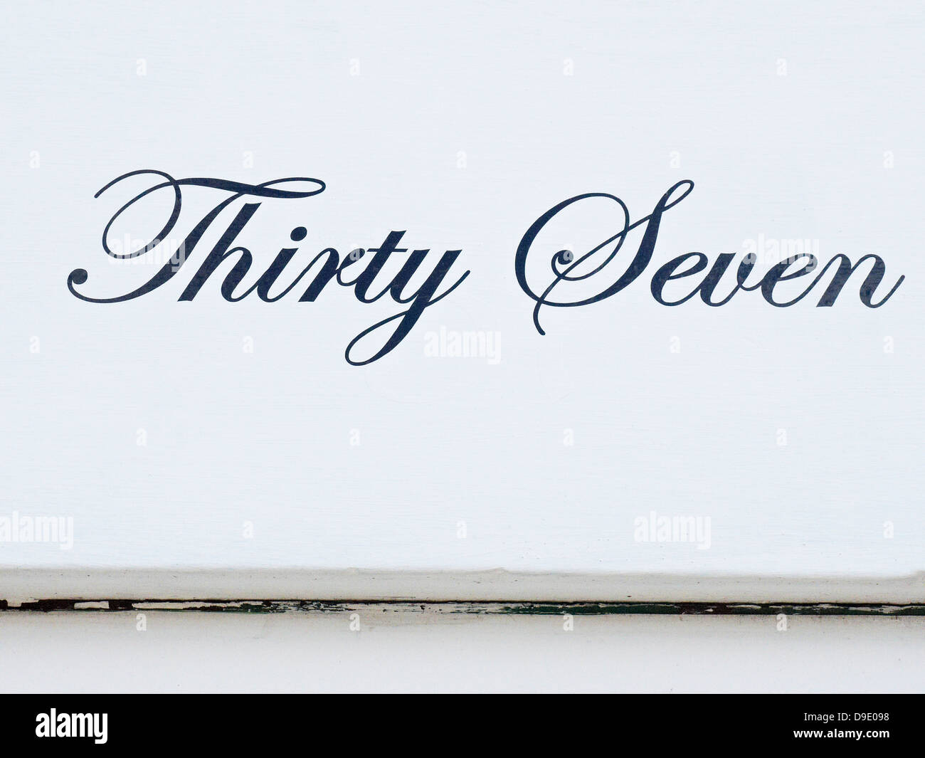 Thirty seven house number above door Stock Photo - Alamy