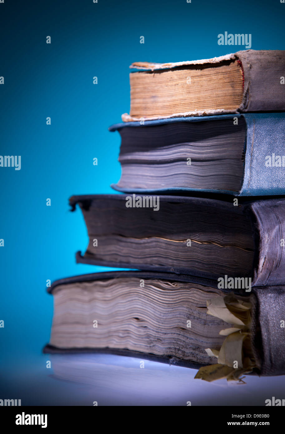 Old books, mystical blue light background Stock Photo - Alamy