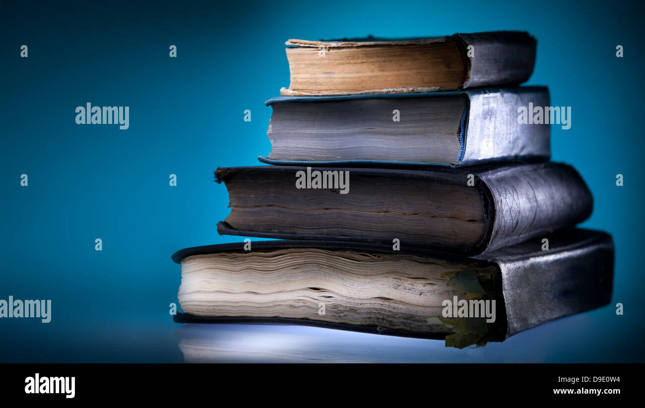 Old books, mystical blue light background Stock Photo - Alamy