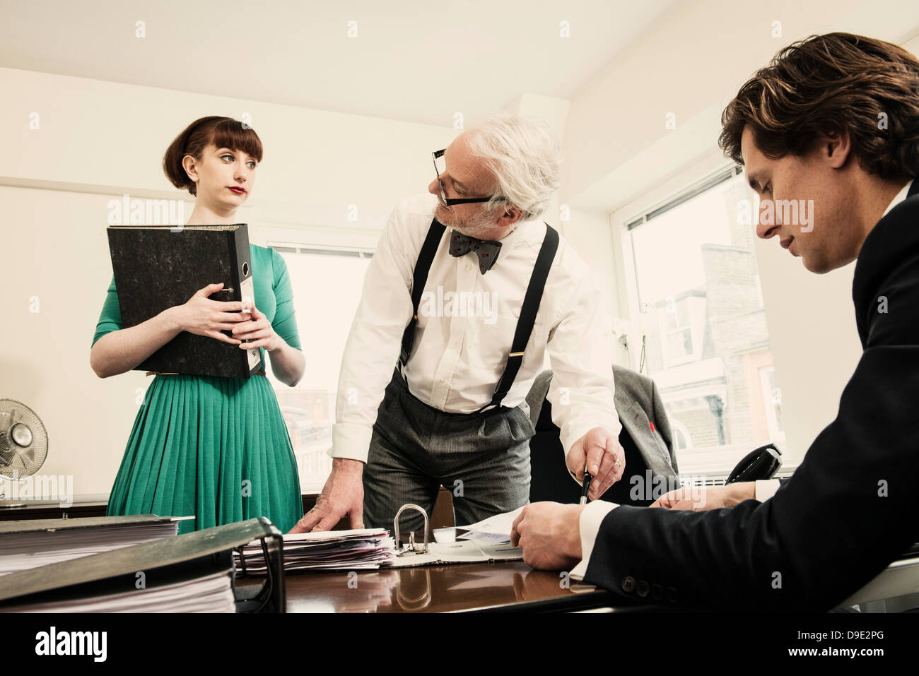Secretary with two men in office Stock Photo - Alamy
