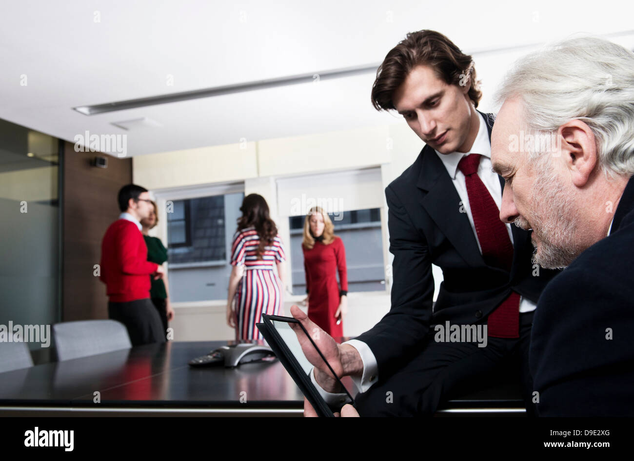 Business executives in meeting room Stock Photo - Alamy