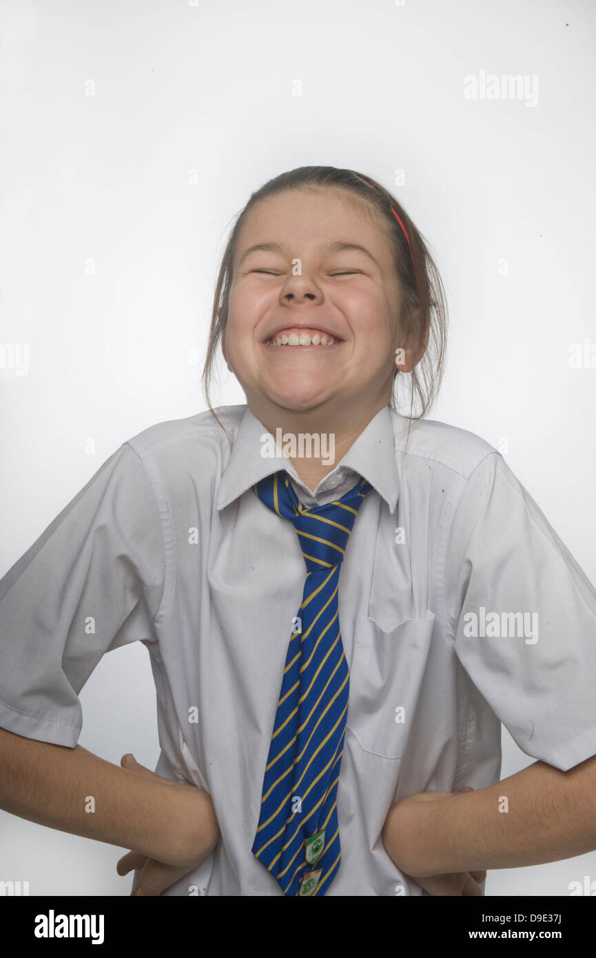Young schoolgirl laughing and giggling Stock Photo - Alamy