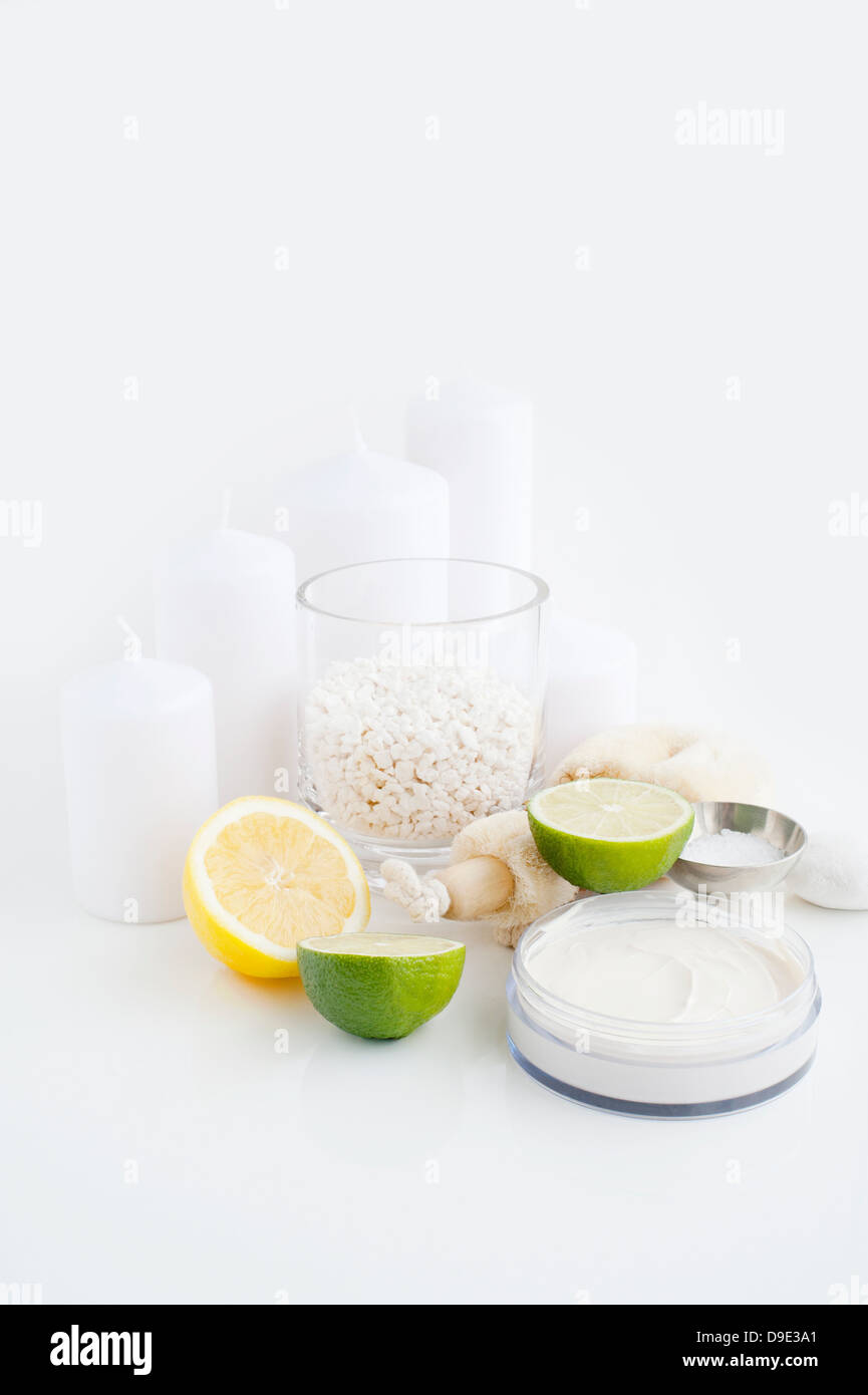Face cream, lemon, lime and candles Stock Photo - Alamy