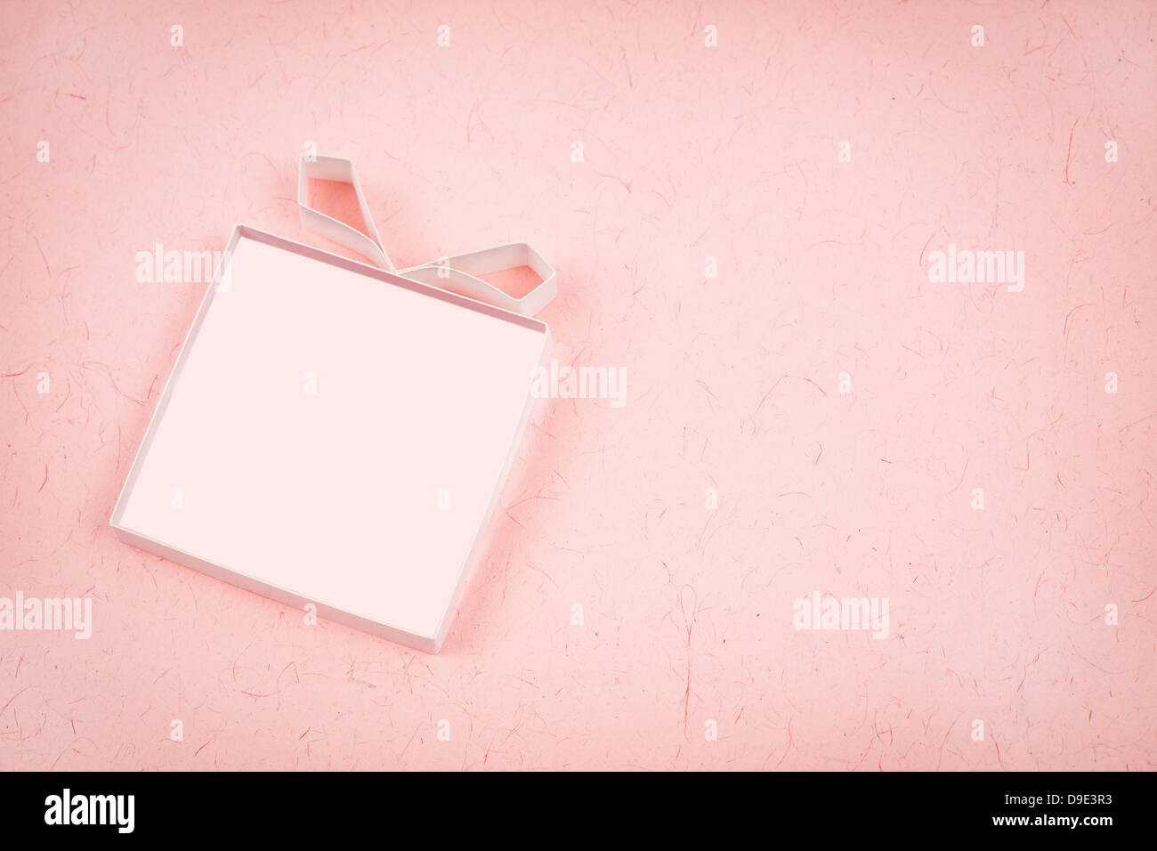 Hand made empty gift box, textured paper as background. Free space for ...