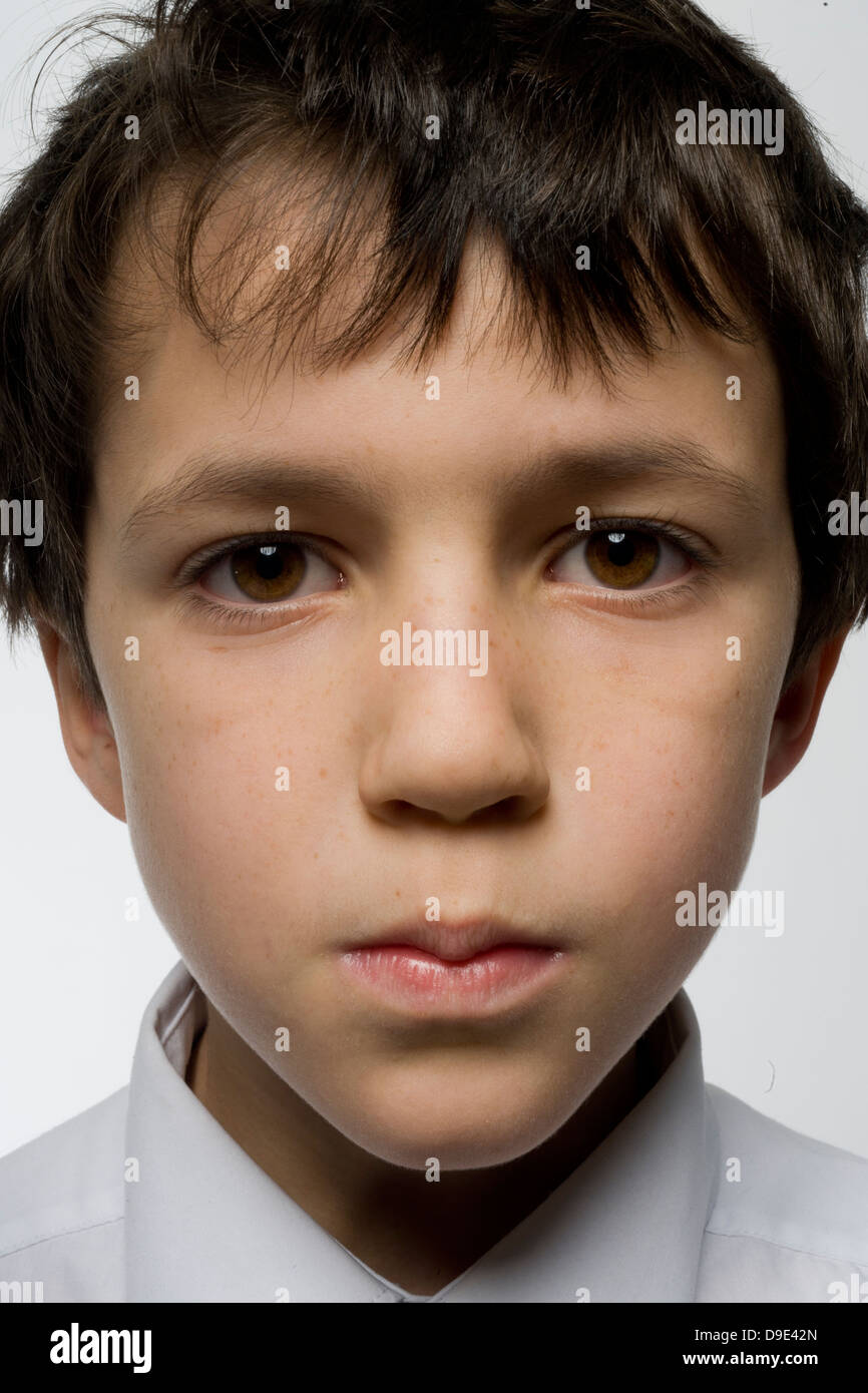 Young schoolboy a confident young boy looking into the camera Stock ...