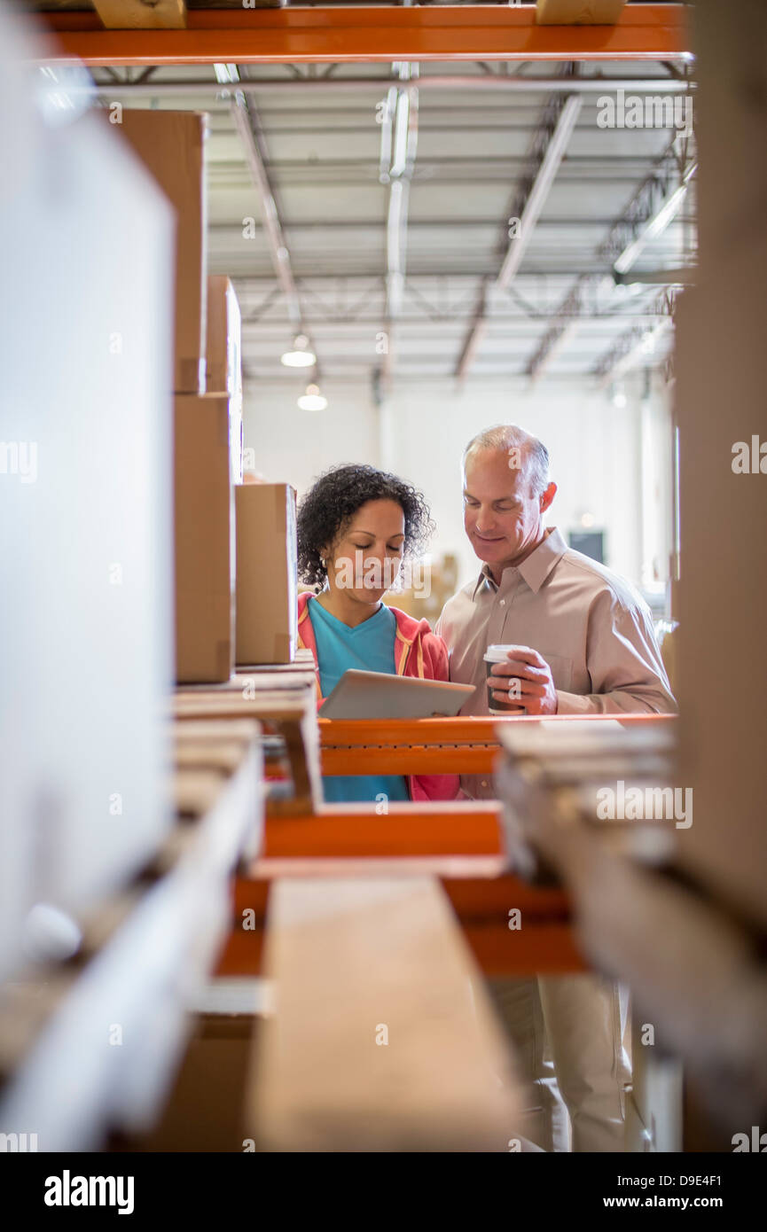 Warehouse workers doing stock take Stock Photo - Alamy